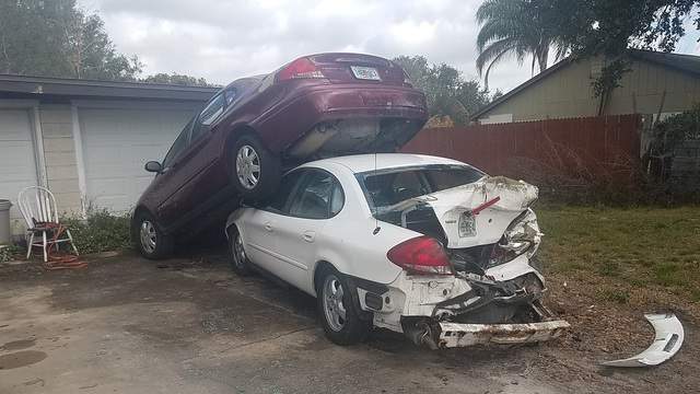 Hit-and-run crash leaves smashed cars stacked in driveway